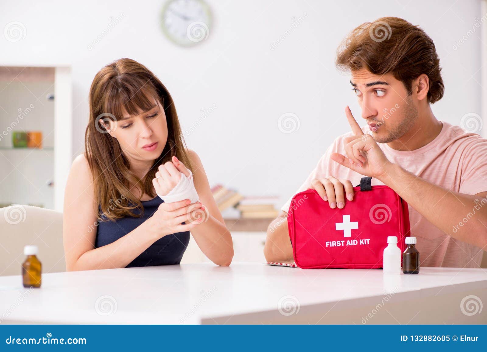 The Young Family Getting Treatment with First Aid Kit Stock Image ...