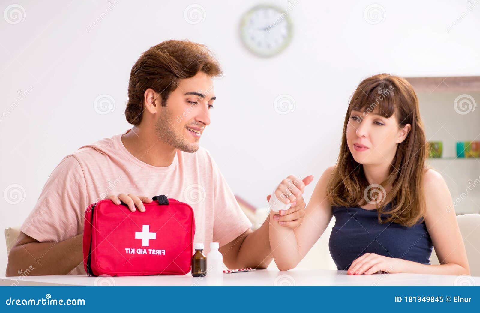 Young Family Getting Treatment with First Aid Kit Stock Image - Image ...