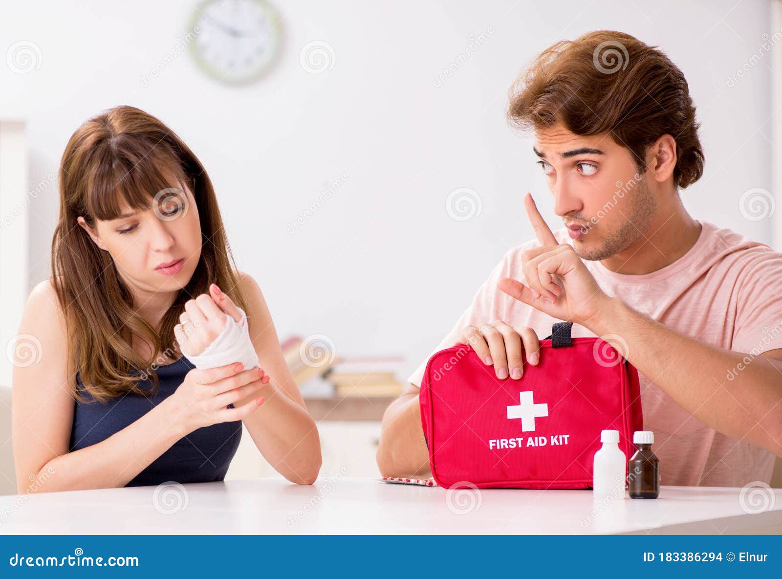 Young Family Getting Treatment with First Aid Kit Stock Photo - Image ...