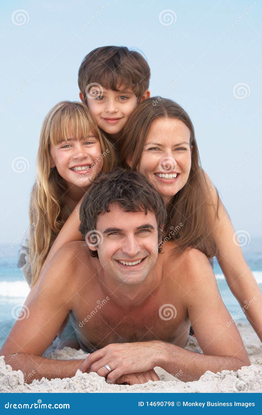 Young Family Having Fun on Beach Holiday Stock Photo - Image of length ...