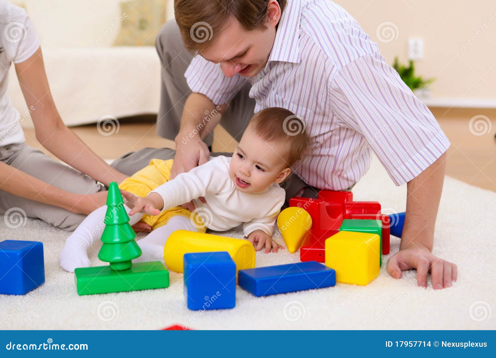Young Family at Home Playing with a Baby Stock Photo - Image of ...