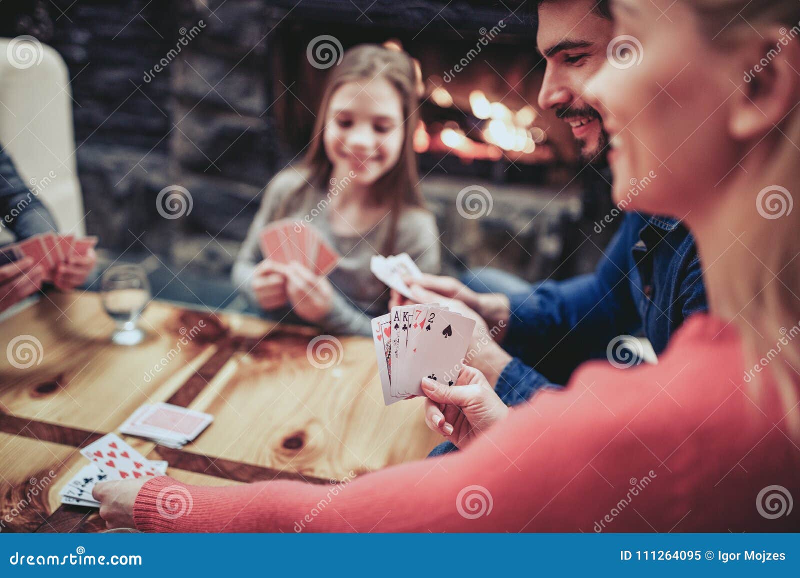 Young Family Playing Card Game Stock Image - Image of enjoying, aged ...