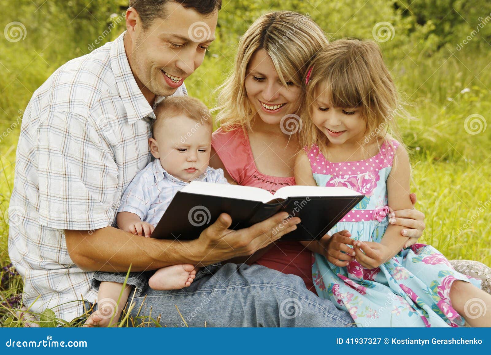Young Family Reading the Bible in Nature Stock Image - Image of ...