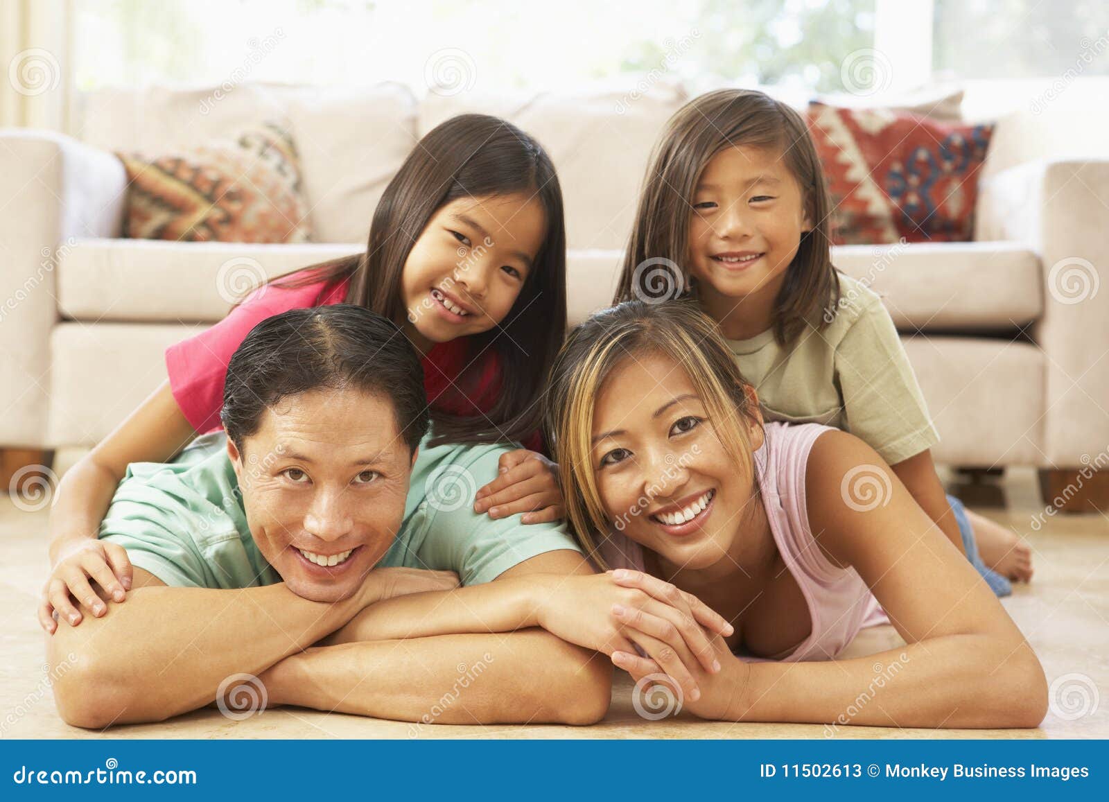 Young Family Relaxing at Home Stock Image - Image of family, room: 11502613