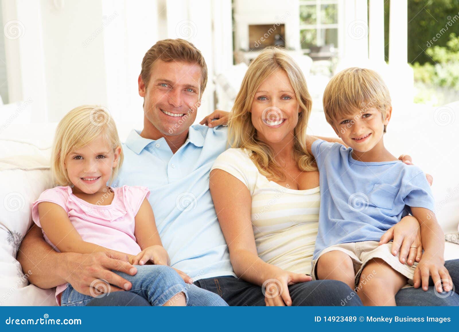 Young Family Relaxing Together on Sofa Stock Image - Image of affection ...