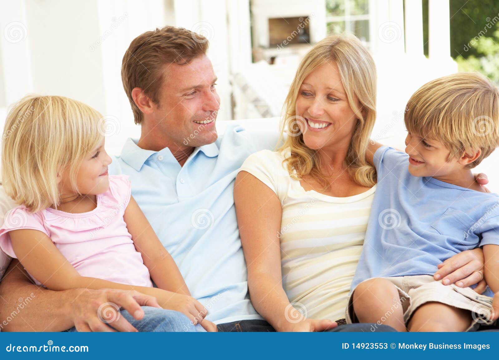 Young Family Relaxing Together on Sofa Stock Image - Image of portrait ...