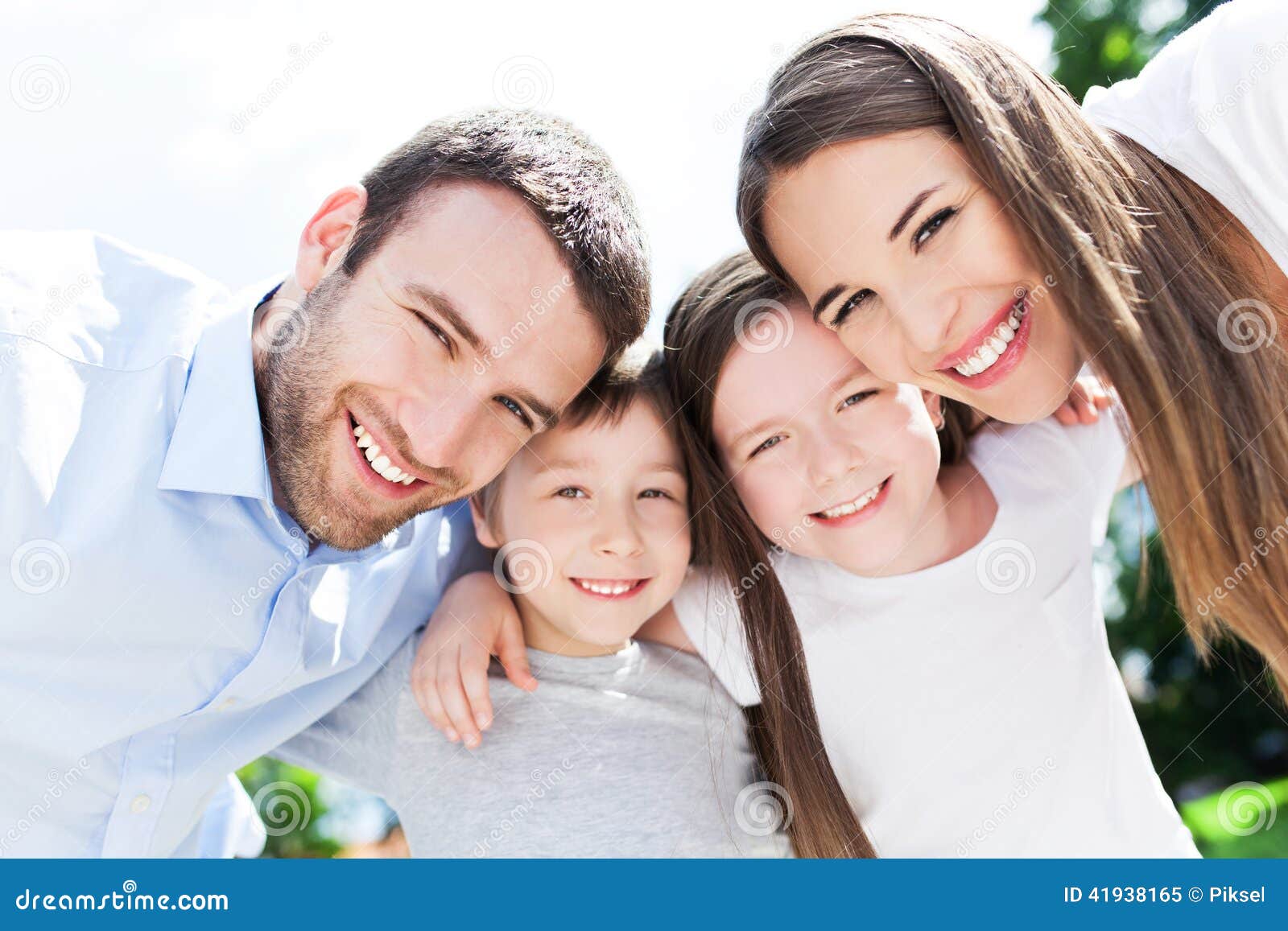 Young family smiling stock image. Image of four, caucasian - 41938165