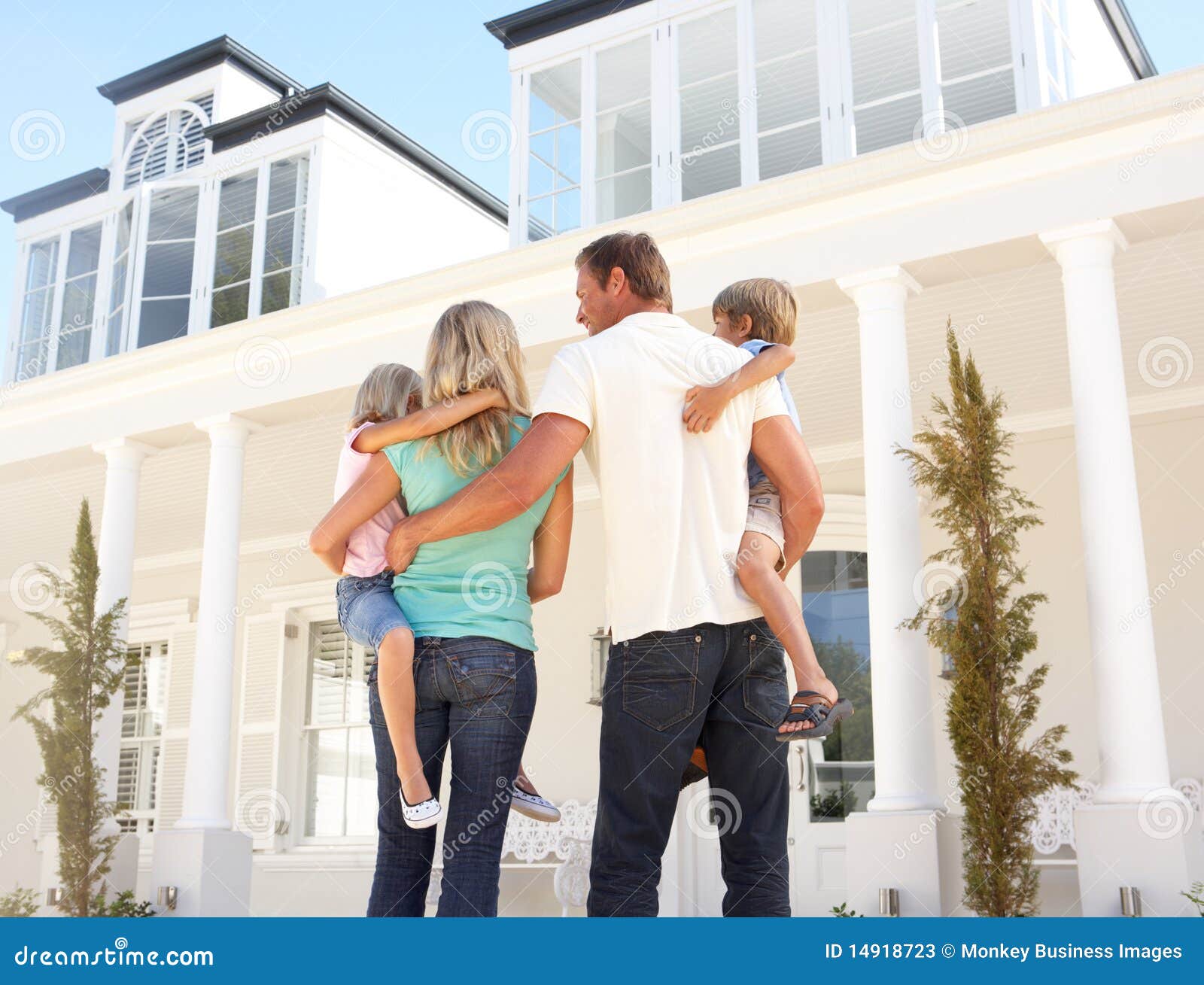 Young Family Standing Outside Dream Home Stock Photos - Image: 14918723