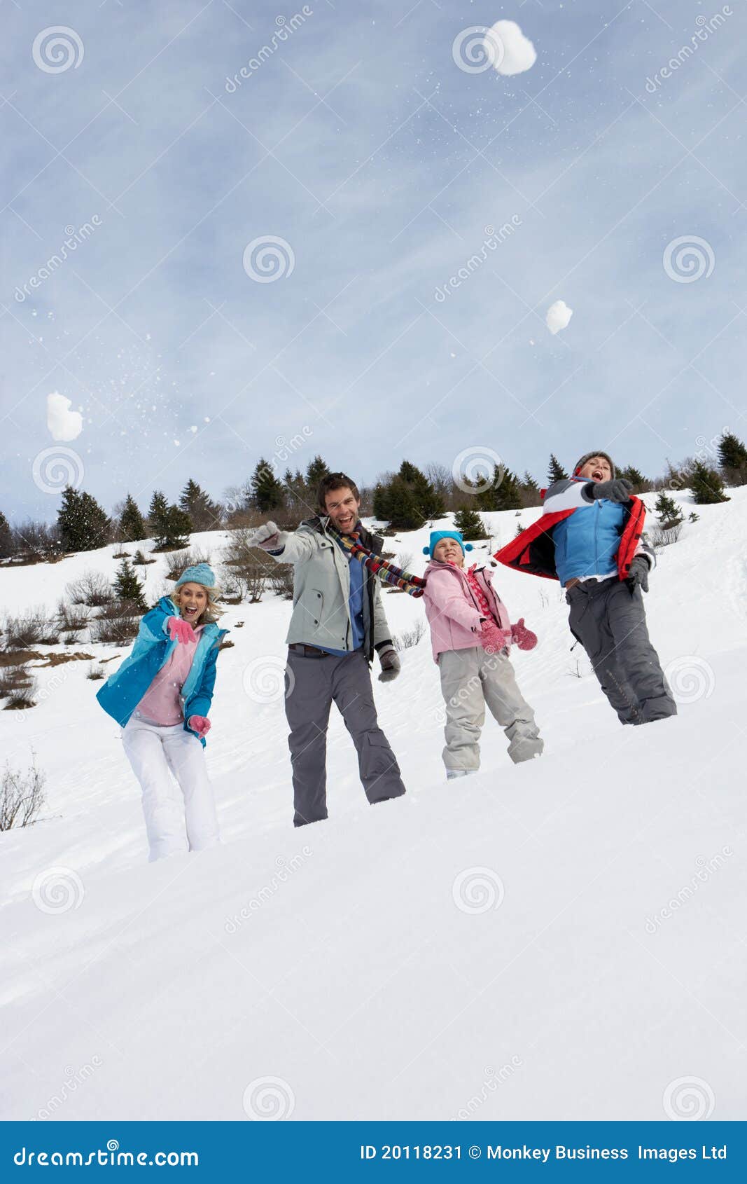 Young Family Throwing Snowballs on Winter Vacation Stock Image - Image ...