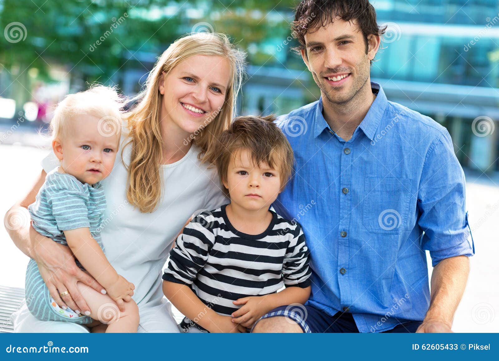 Young family with two kids stock image. Image of offspring - 62605433