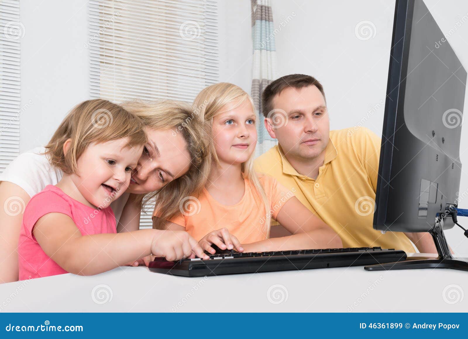 Young Family Using Computer Together Stock Image - Image of family ...
