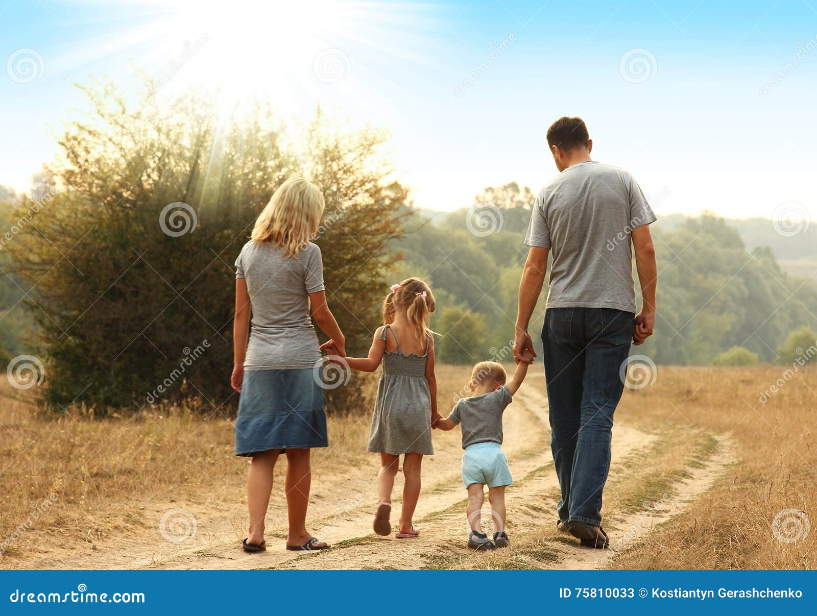 Young family walk together stock image. Image of young - 75810033