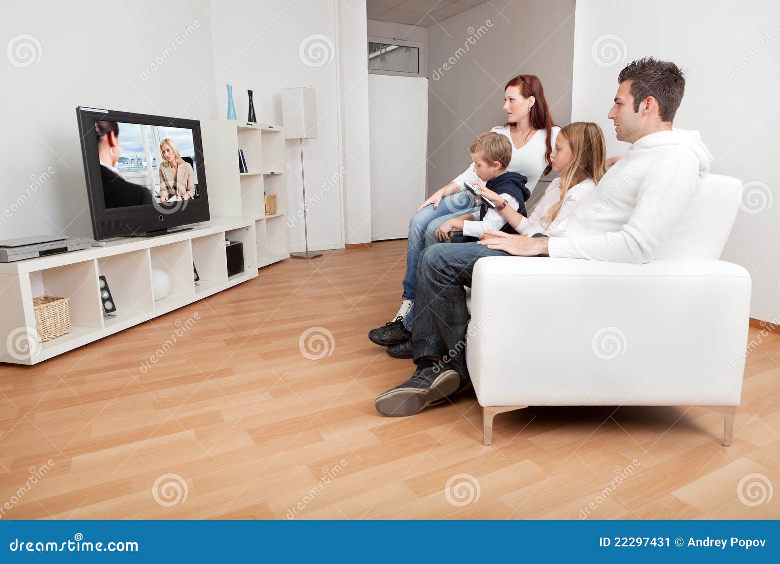 Young Family Watching TV at Home Stock Image - Image of girl, four ...
