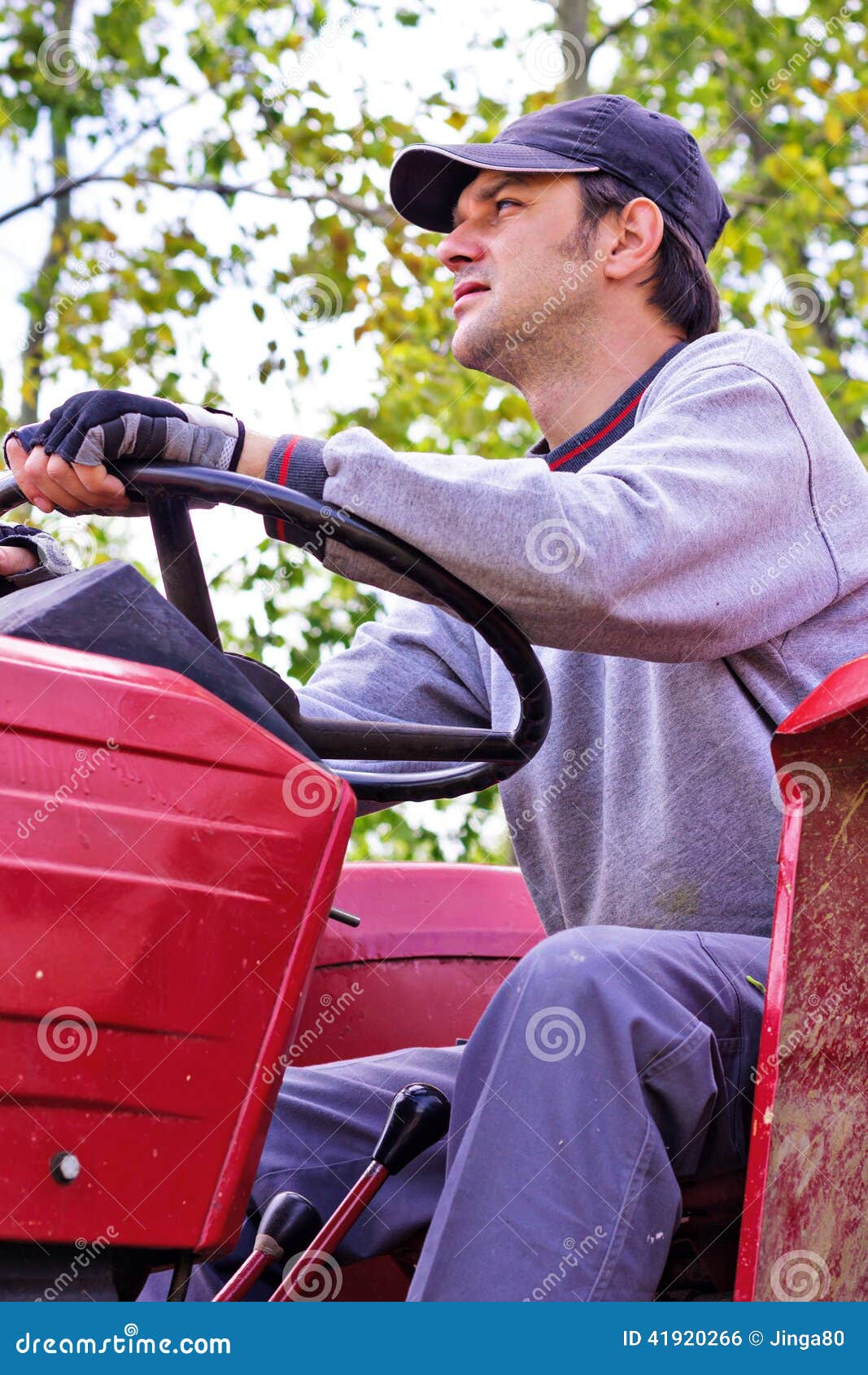 Young Farmer Driving His Tractor Stock Photo - Image of handsome, earth ...