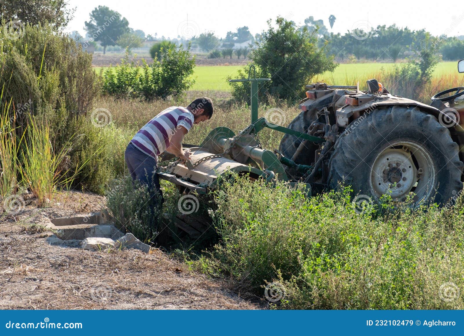 Young Farmer Preparing the Farm Tools To Start the Cultivation of the ...