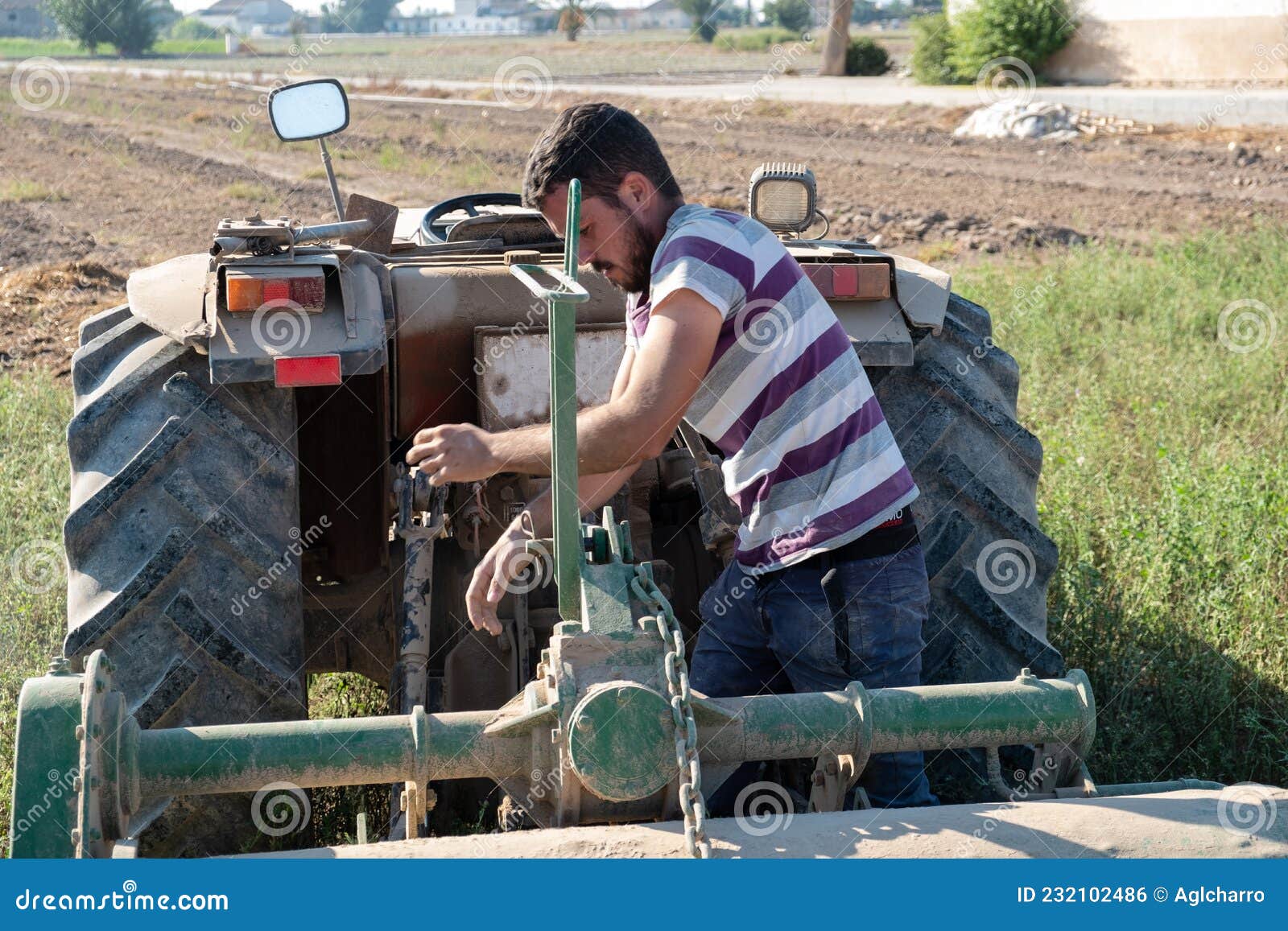 Young Farmer Preparing the Farm Tools To Start the Cultivation of the ...