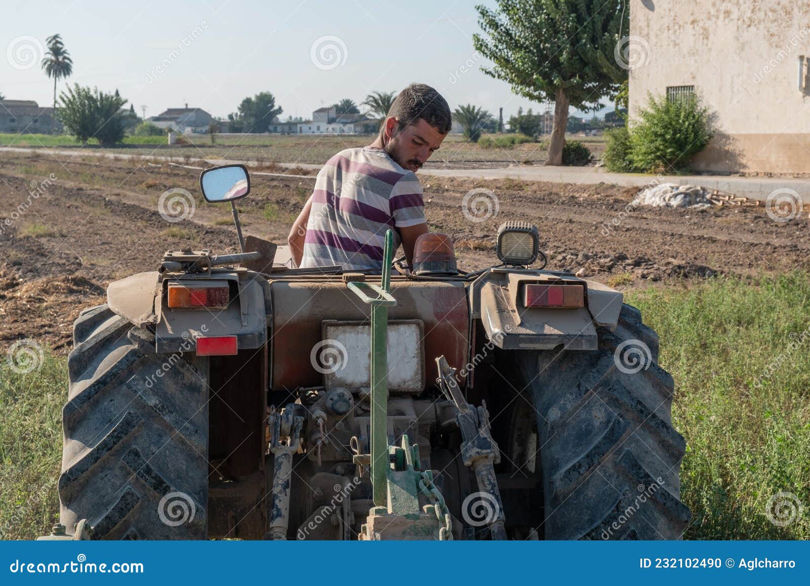 Young Farmer Preparing the Farm Tools To Start the Cultivation of the ...