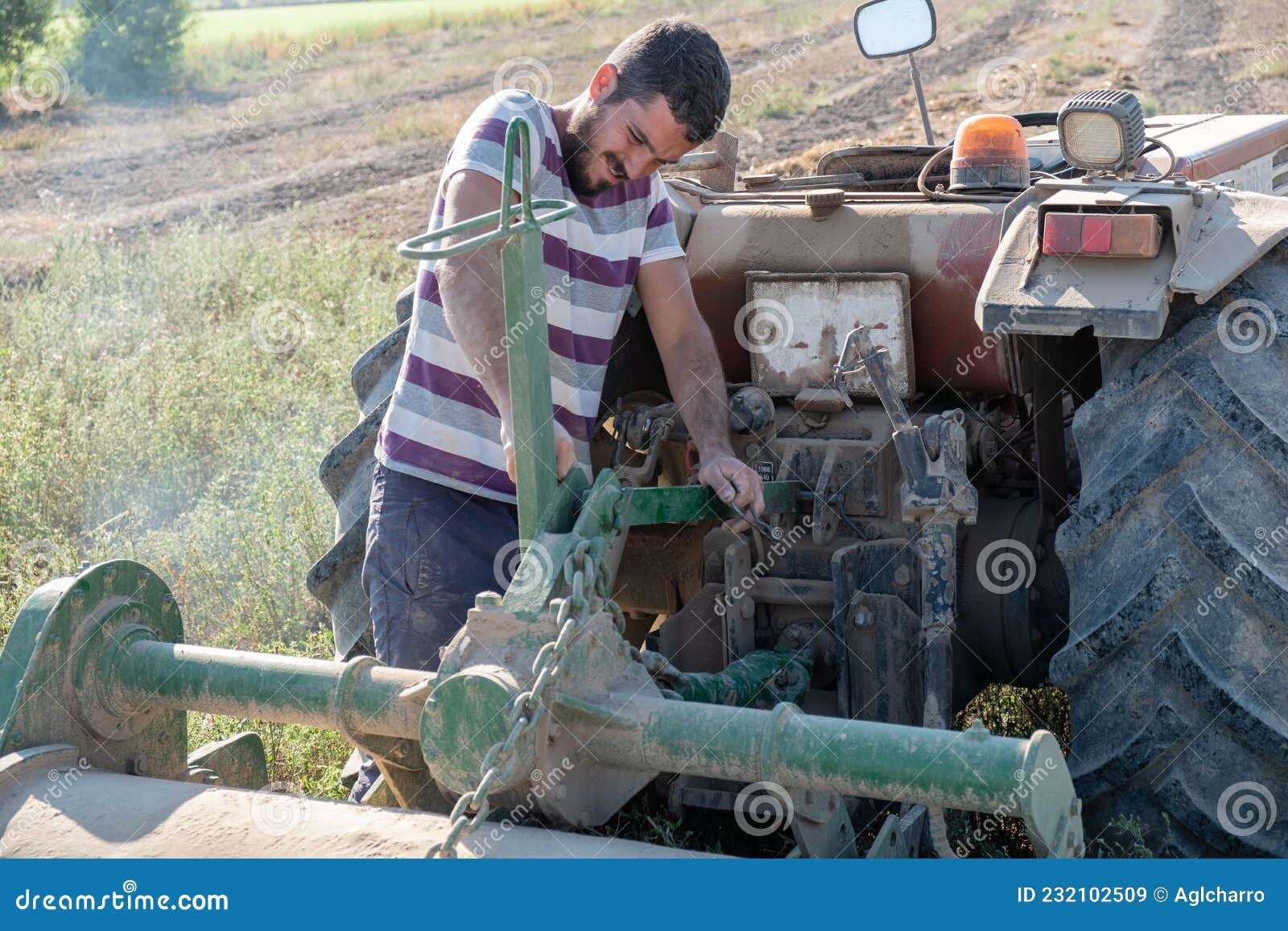 Young Farmer Preparing The Farm Tools To Start The Cultivation Of The ...