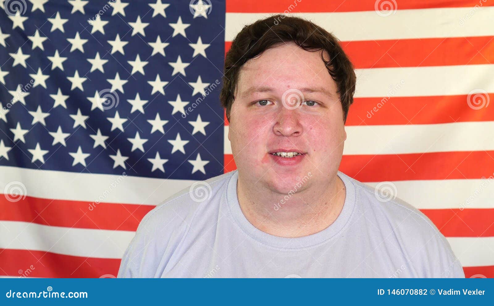 Young Fat Man Winking on the Background of an USA Flag Stock Footage ...