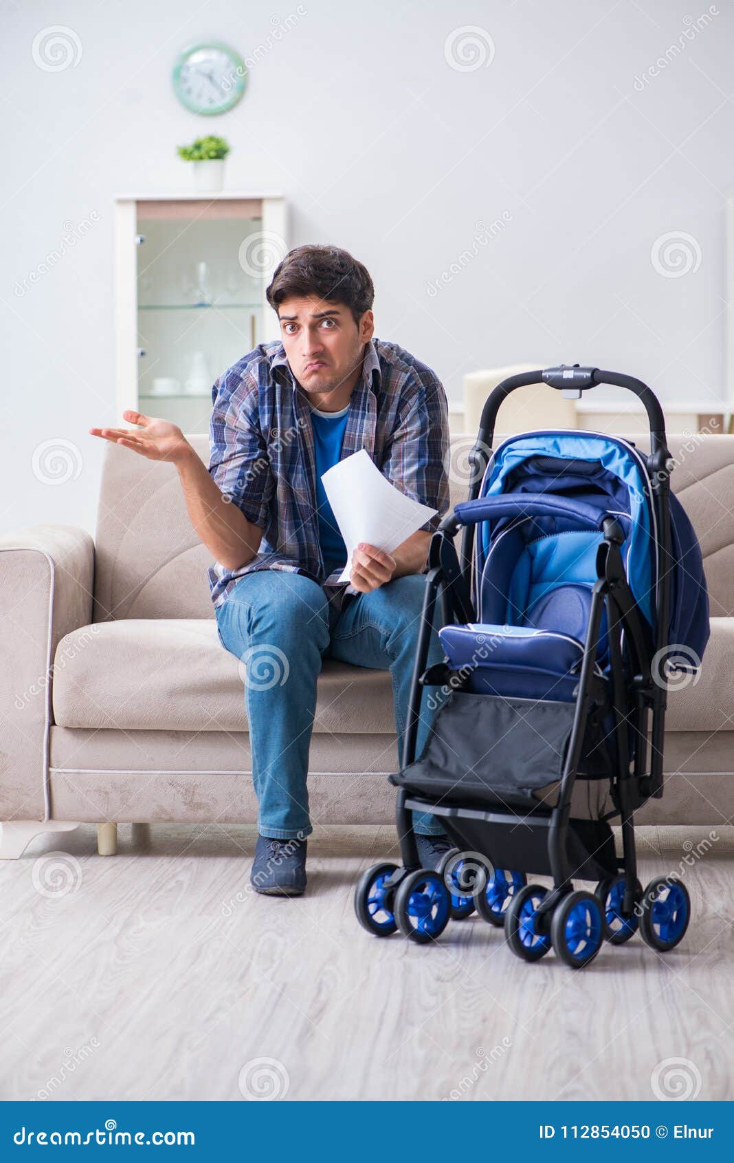 The Young Father Assembling Baby Pram at Home Stock Photo - Image of ...