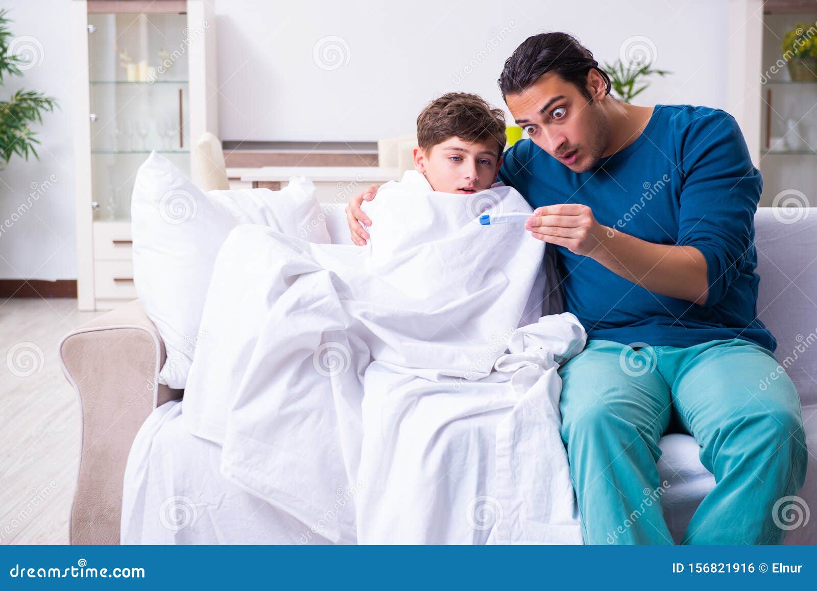 Young Father Caring for Sick Son Stock Photo - Image of sick, patient ...