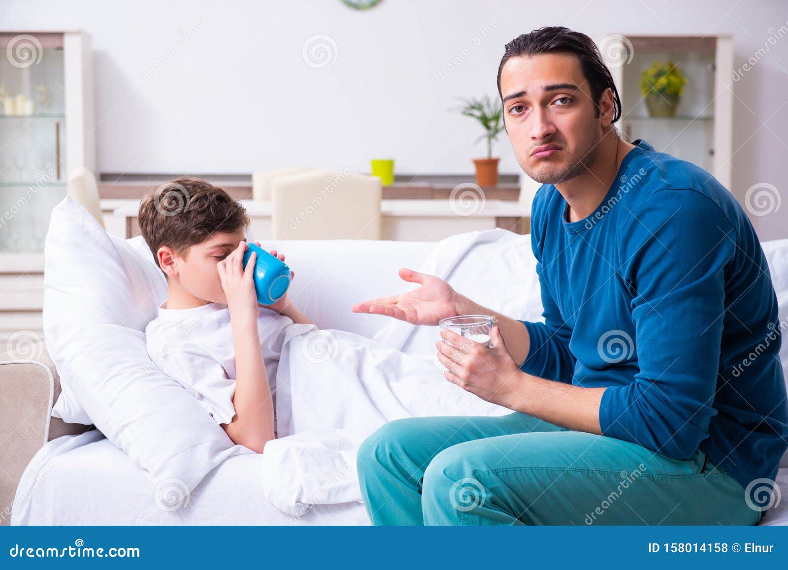 Young Father Caring for Sick Son Stock Photo - Image of coughing ...