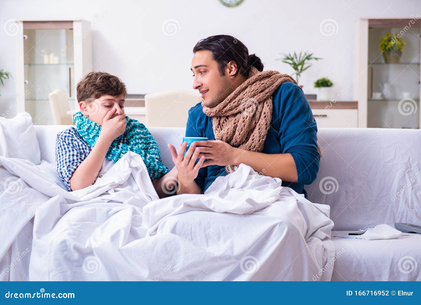 Young Father Caring for Sick Son Stock Photo - Image of parent ...