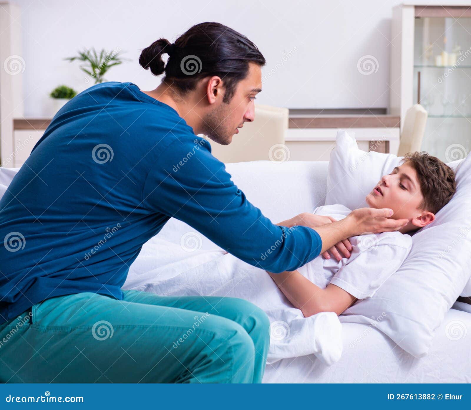 Young Father Caring for Sick Son Stock Photo - Image of sick, home ...