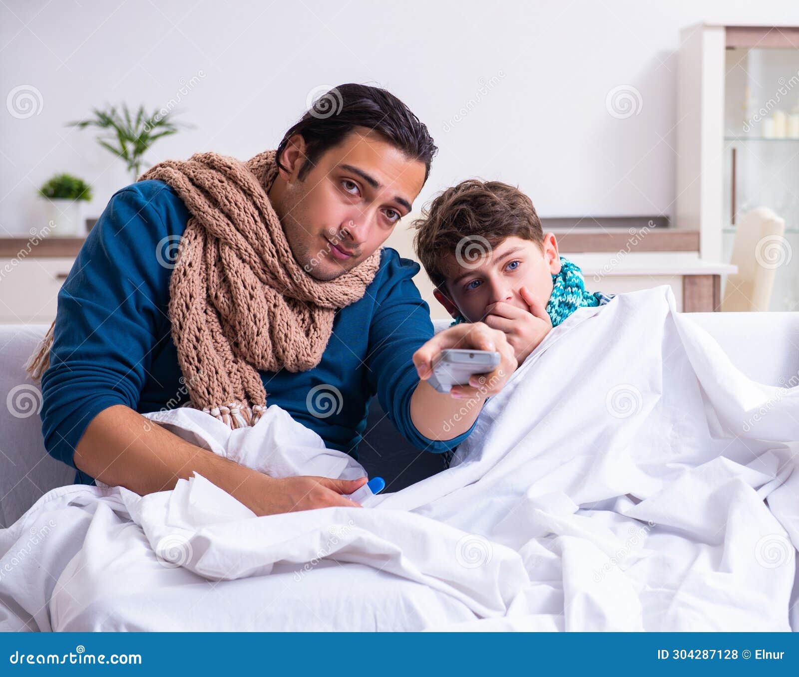 Young Father Caring for Sick Son Stock Photo - Image of medicine ...