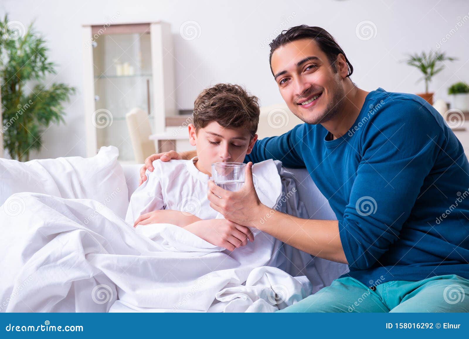 Young Father Caring for Sick Son Stock Photo - Image of allergy ...