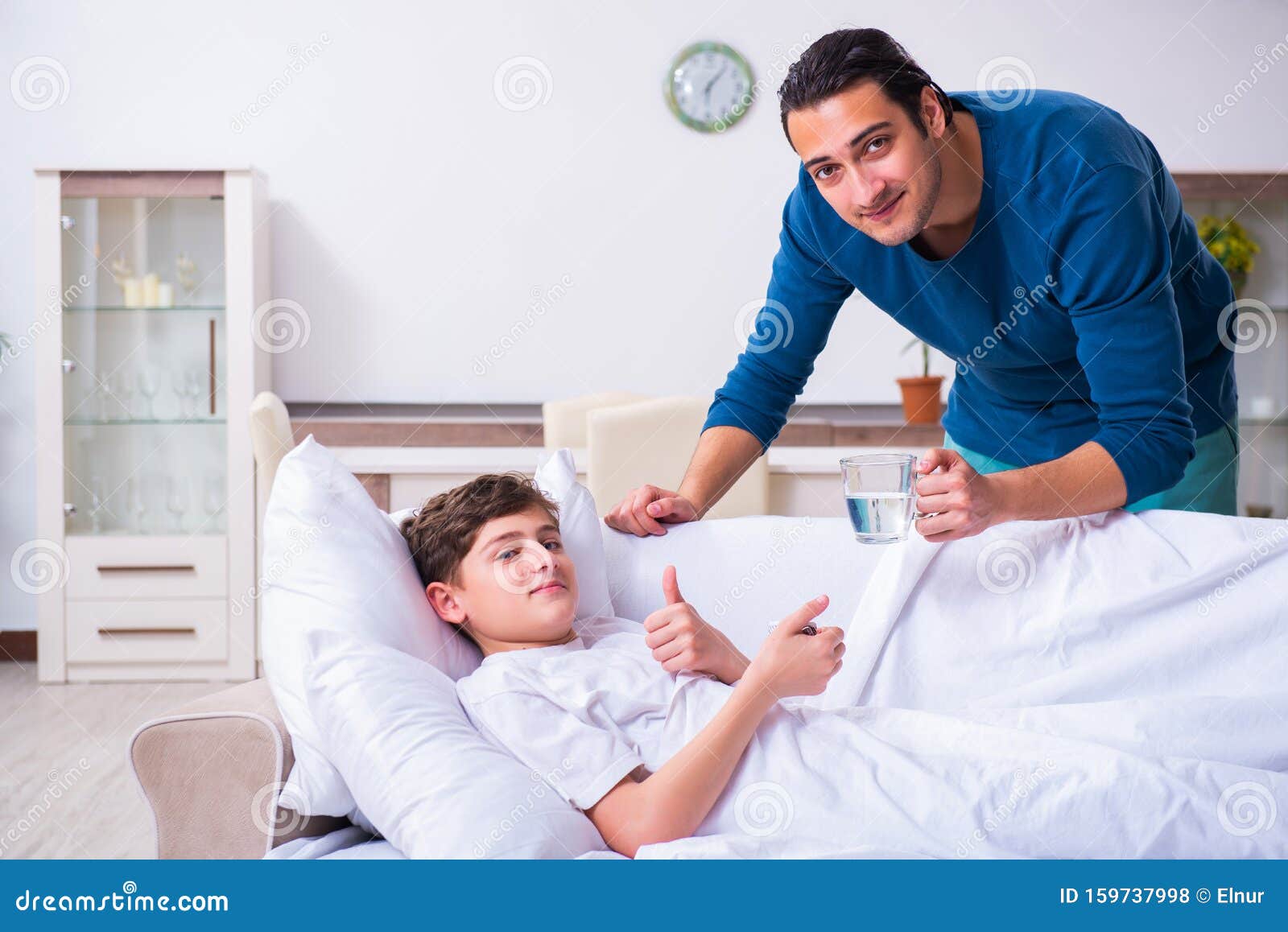 Young Father Caring for Sick Son Stock Photo - Image of recovery ...