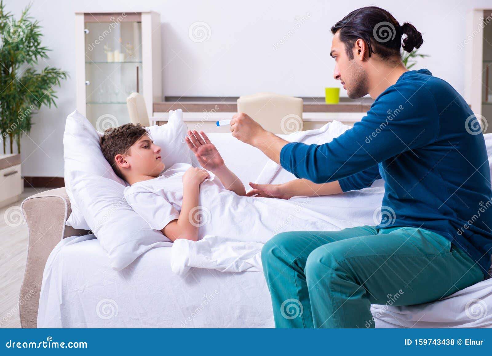 Young Father Caring for Sick Son Stock Photo - Image of coughing ...