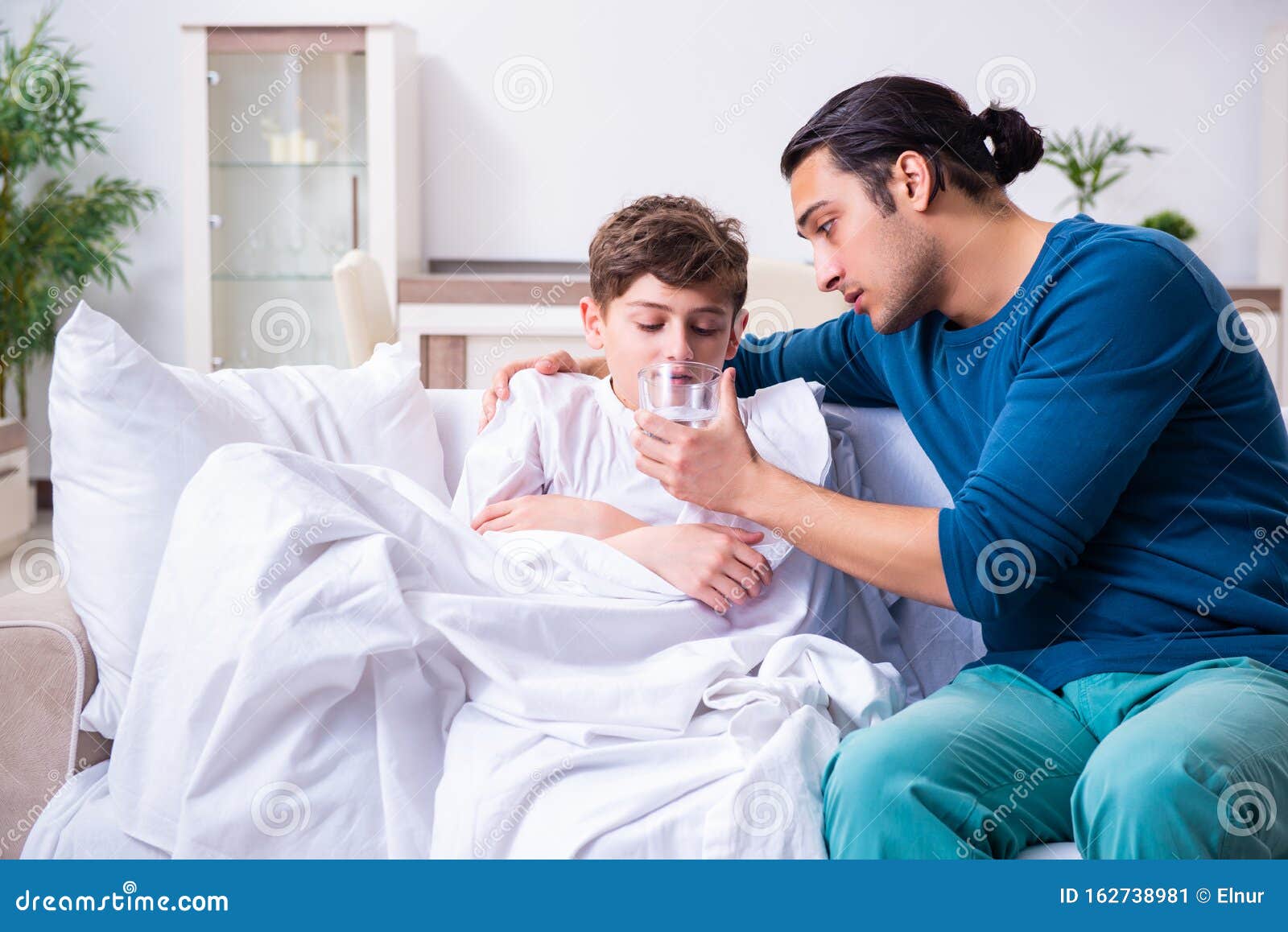 Young Father Caring for Sick Son Stock Image - Image of influenza ...