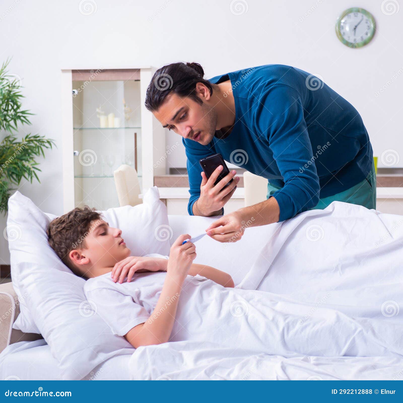 Young Father Caring for Sick Son Stock Photo - Image of family ...