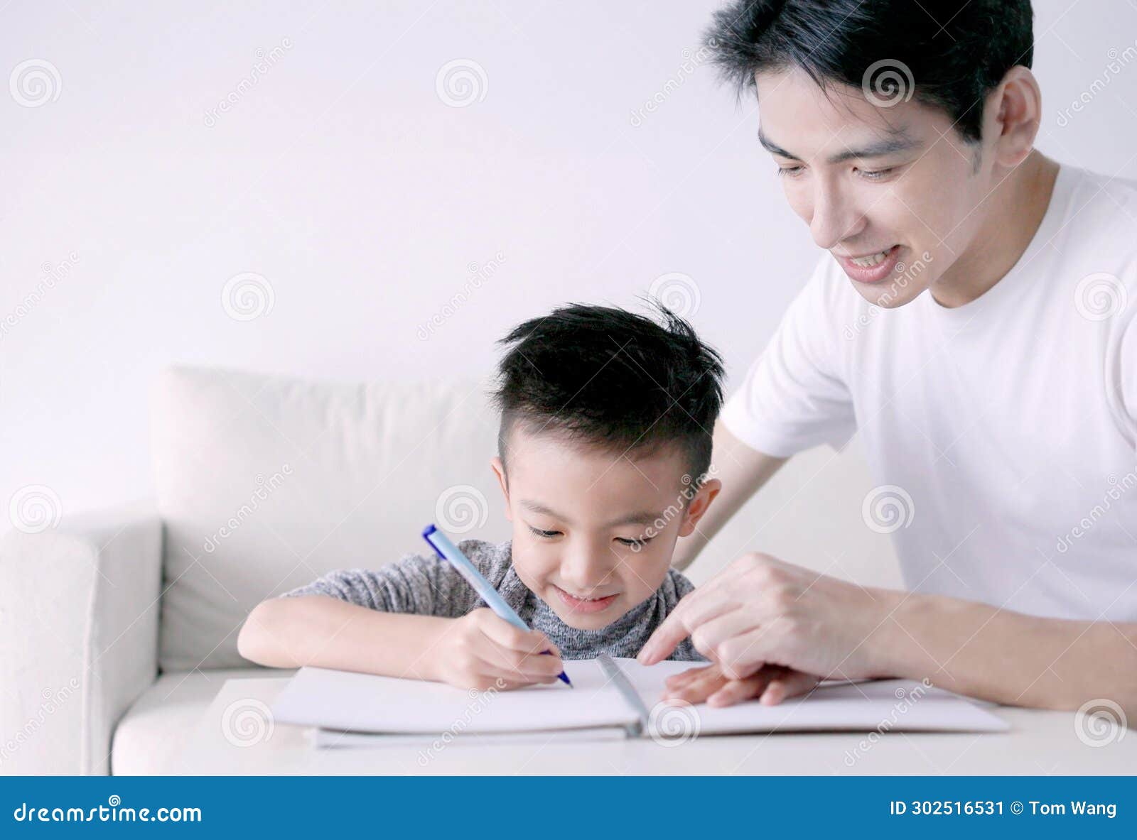 Young Father Checking Homework Helping Child with Study at Home Stock ...