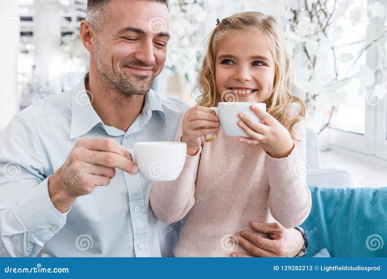 Young Father and Daughter Drinking Tea Stock Photo - Image of parent ...