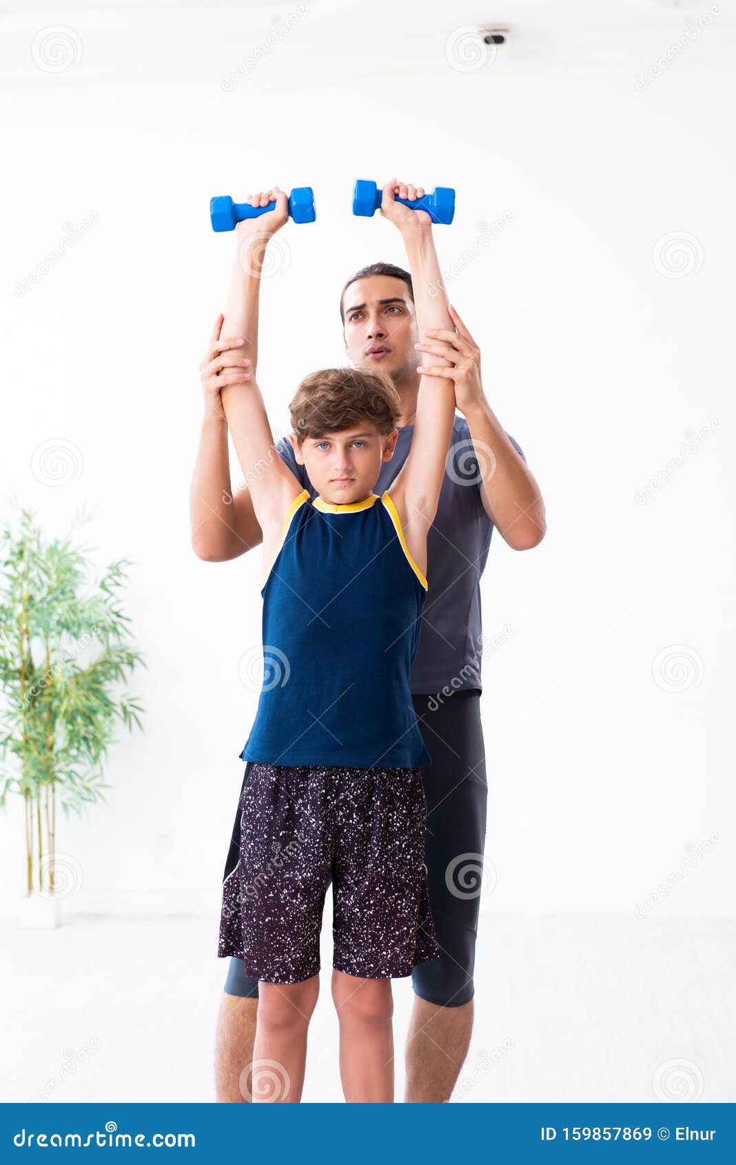 Young Father and His Son Doing Exercises Stock Image - Image of ...