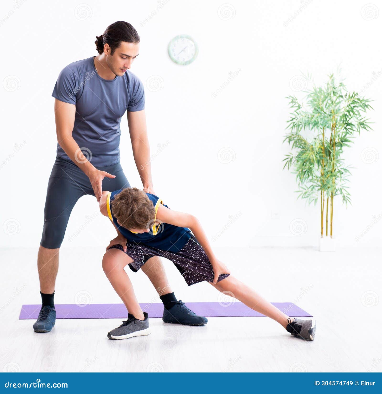 Young Father and His Son Doing Exercises Stock Image - Image of coach ...