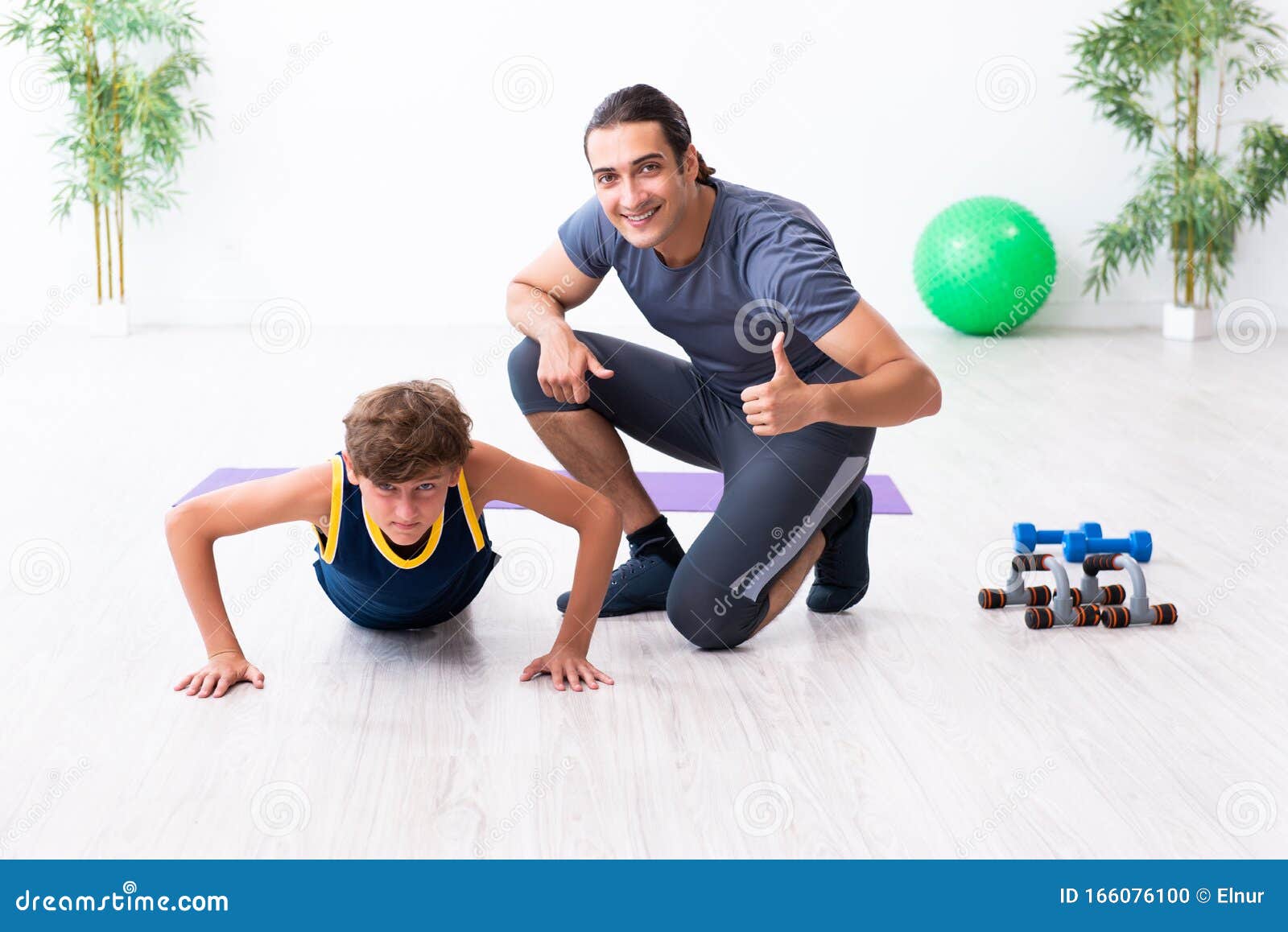 Young Father and His Son Doing Exercises Stock Photo - Image of ...