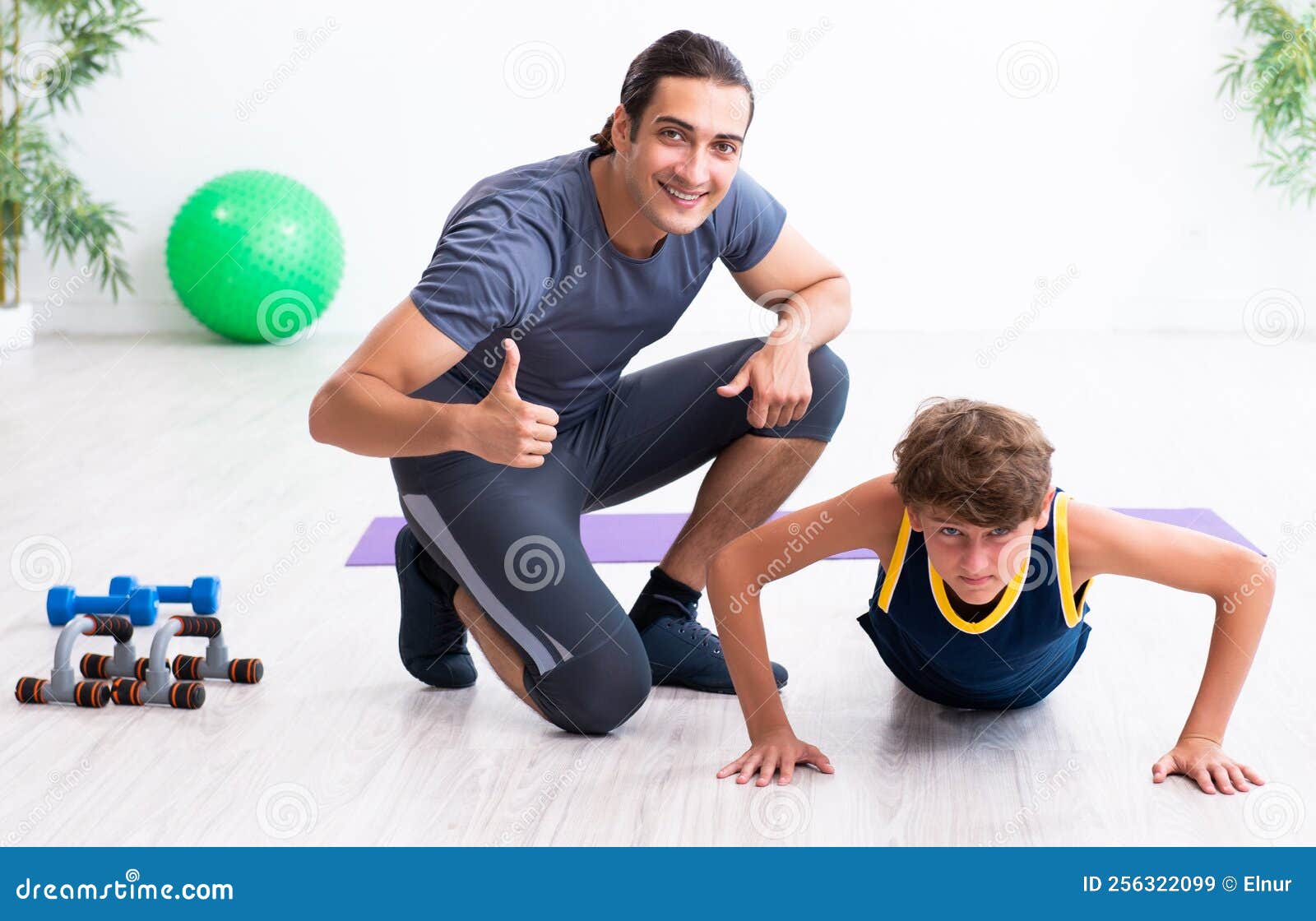 Young Father and His Son Doing Exercises Stock Image - Image of coach ...