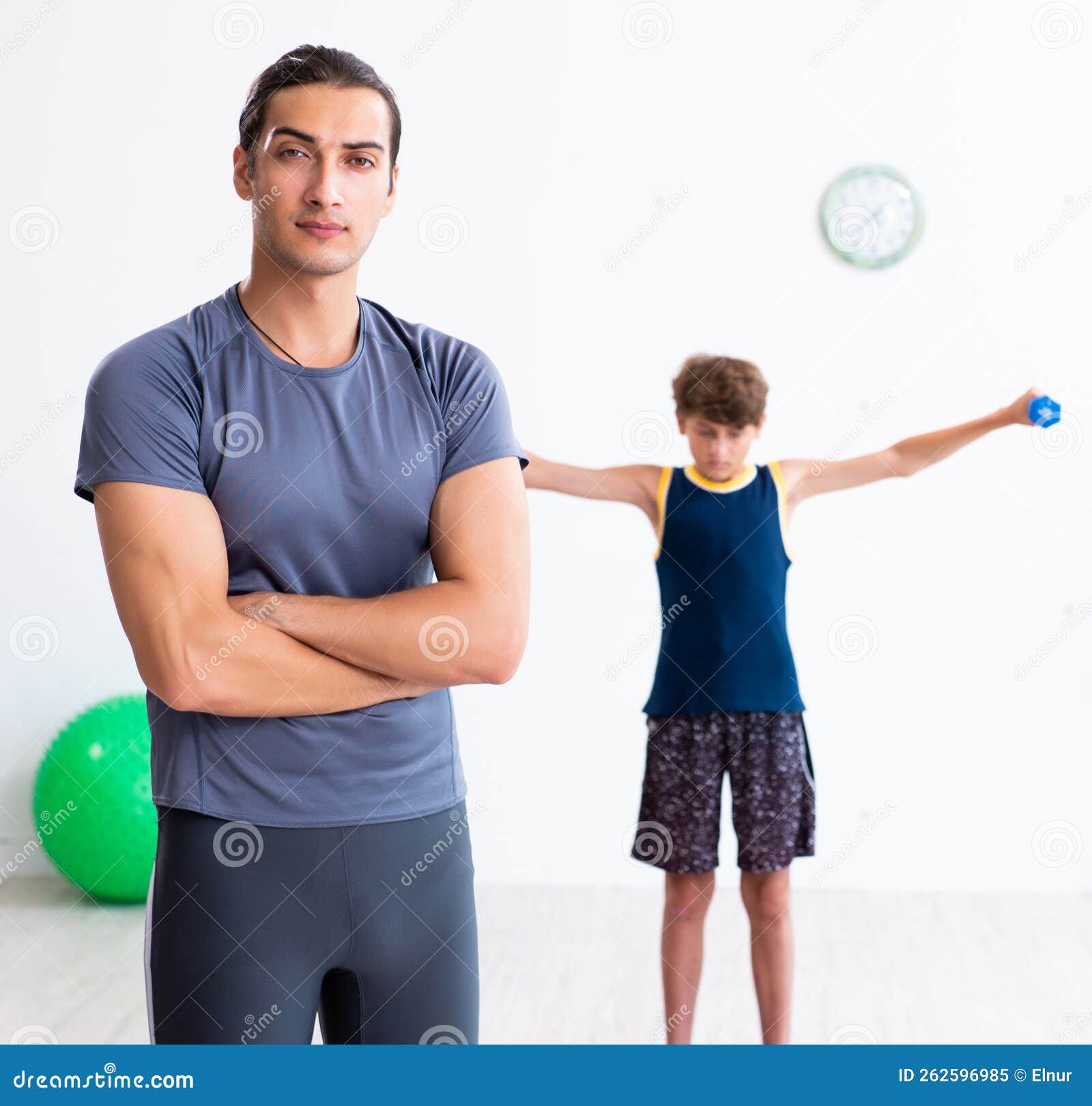 Young Father and His Son Doing Exercises Stock Image - Image of body ...