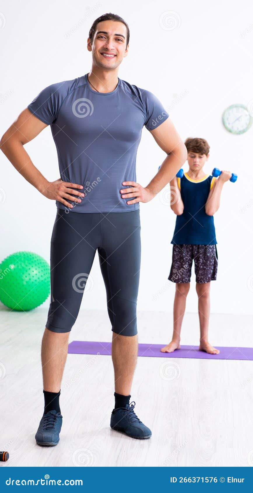 Young Father and His Son Doing Exercises Stock Photo - Image of family ...