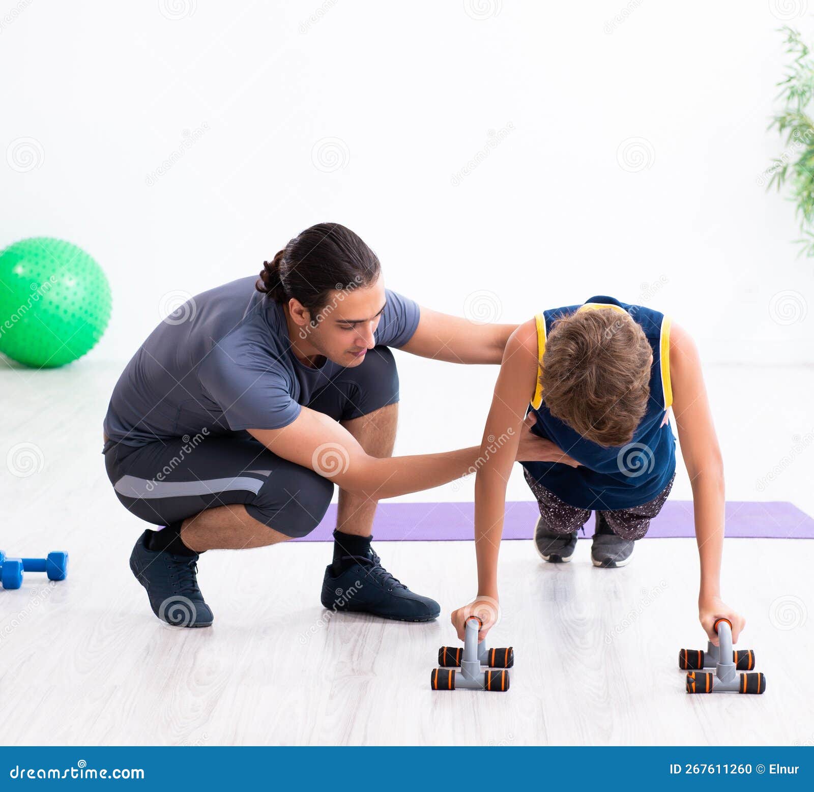 Young Father and His Son Doing Exercises Stock Photo - Image of ...