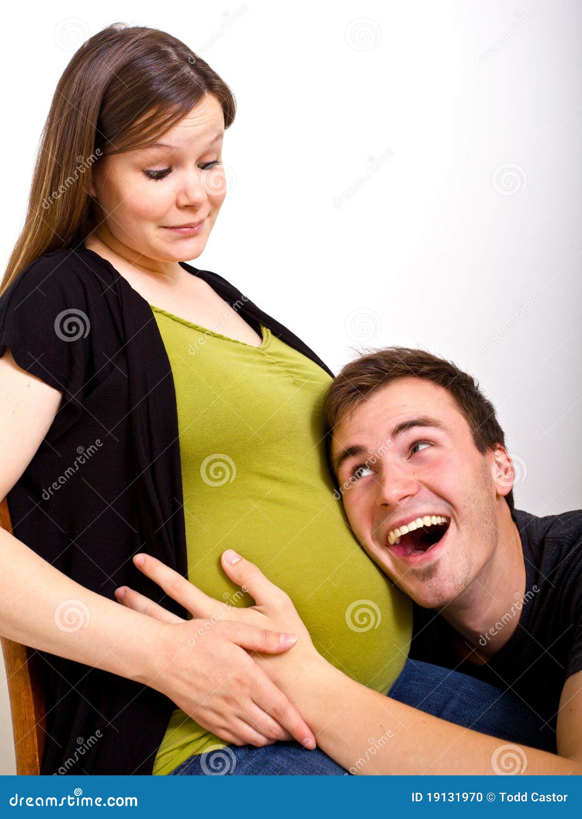 Young Father Listens To Expectant Child Stock Photo - Image of white ...