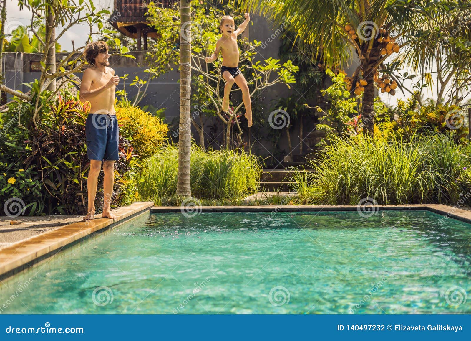 Young Father with Little Son Playing in the Pool Stock Photo - Image of ...