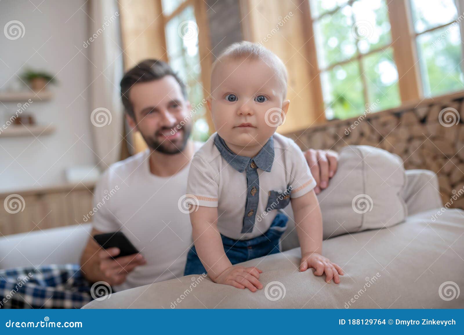 Young Father Looking at His Son and Feeling Good Stock Photo - Image of ...