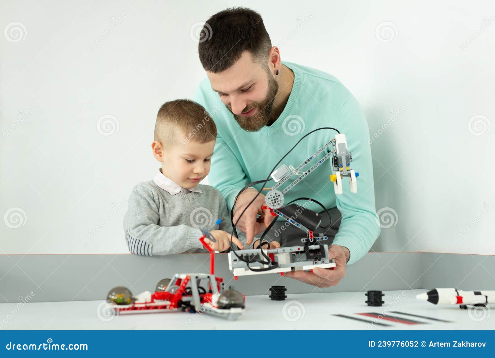 Young Father and Son Create a Robot in a Robotics Club Stock Photo ...