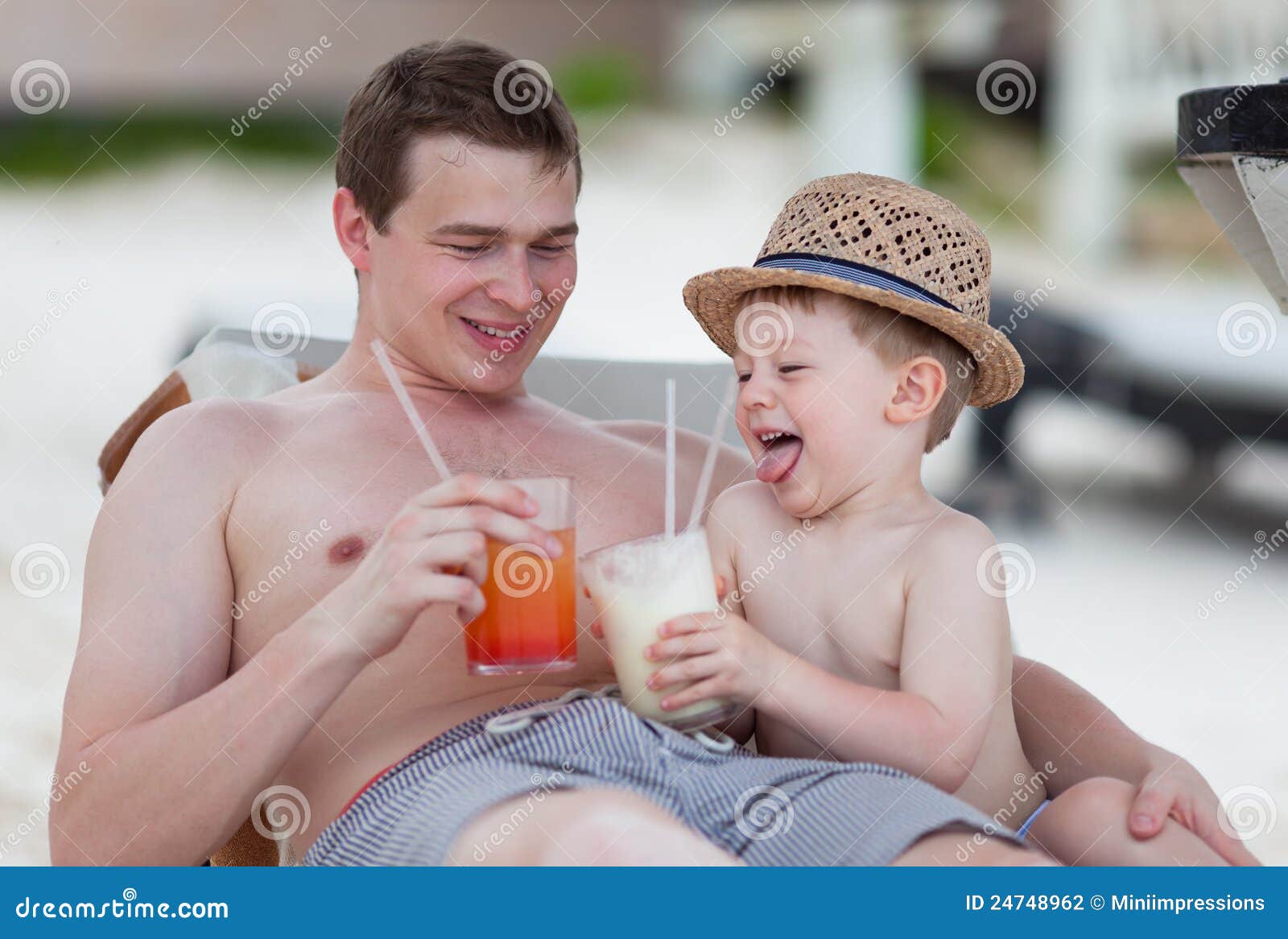 Young Father and Son Drinking Milkshakes Stock Photo - Image of family ...