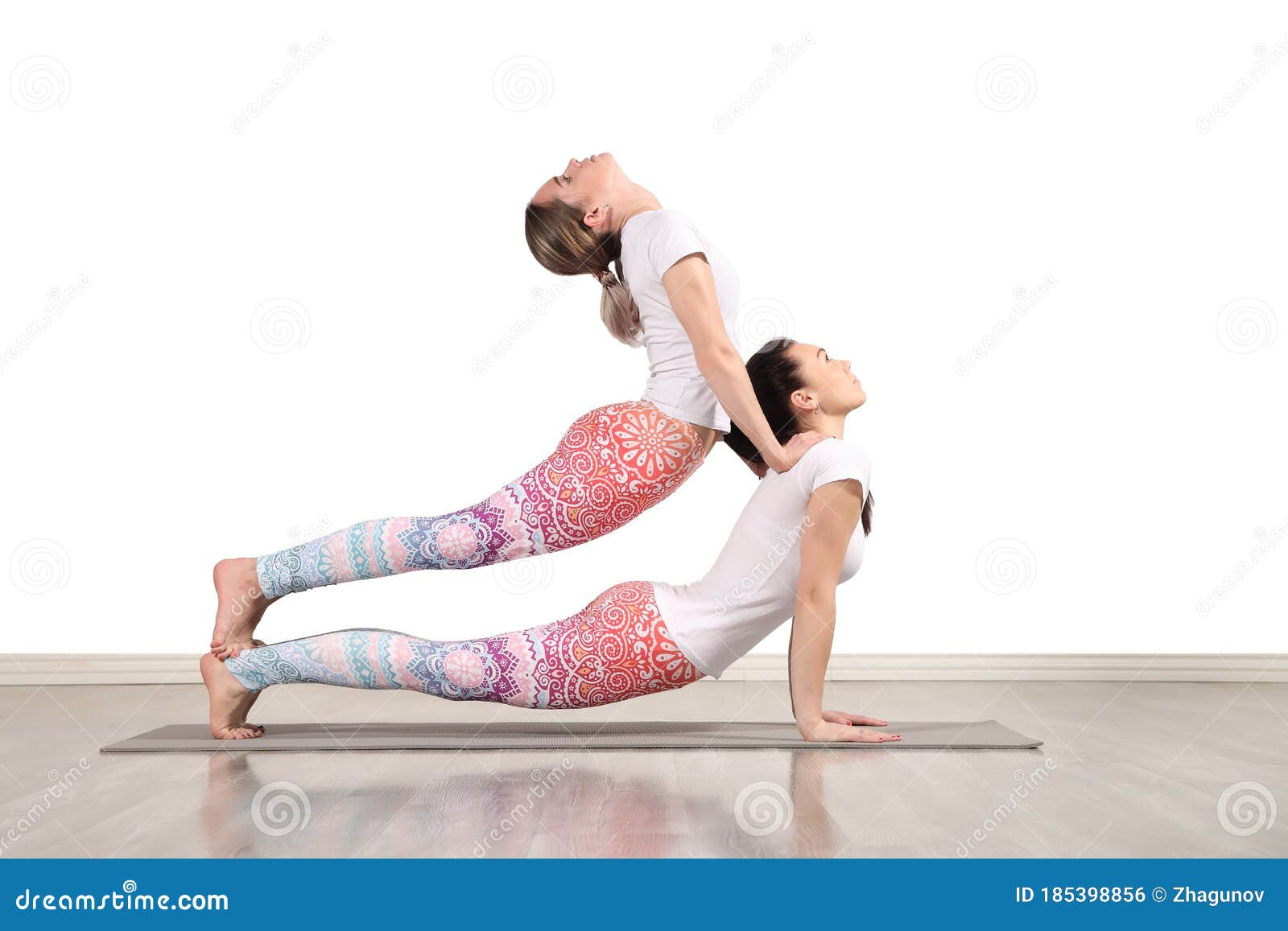 Young Female Acrobats in Beautiful Acrobatic Poses Stock Photo - Image ...