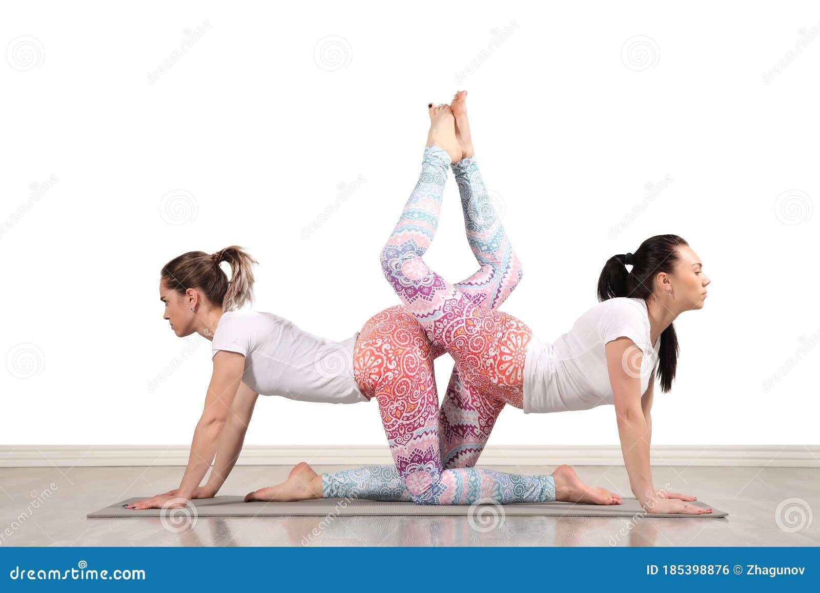 Young Female Acrobats in Beautiful Acrobatic Poses Stock Photo - Image ...